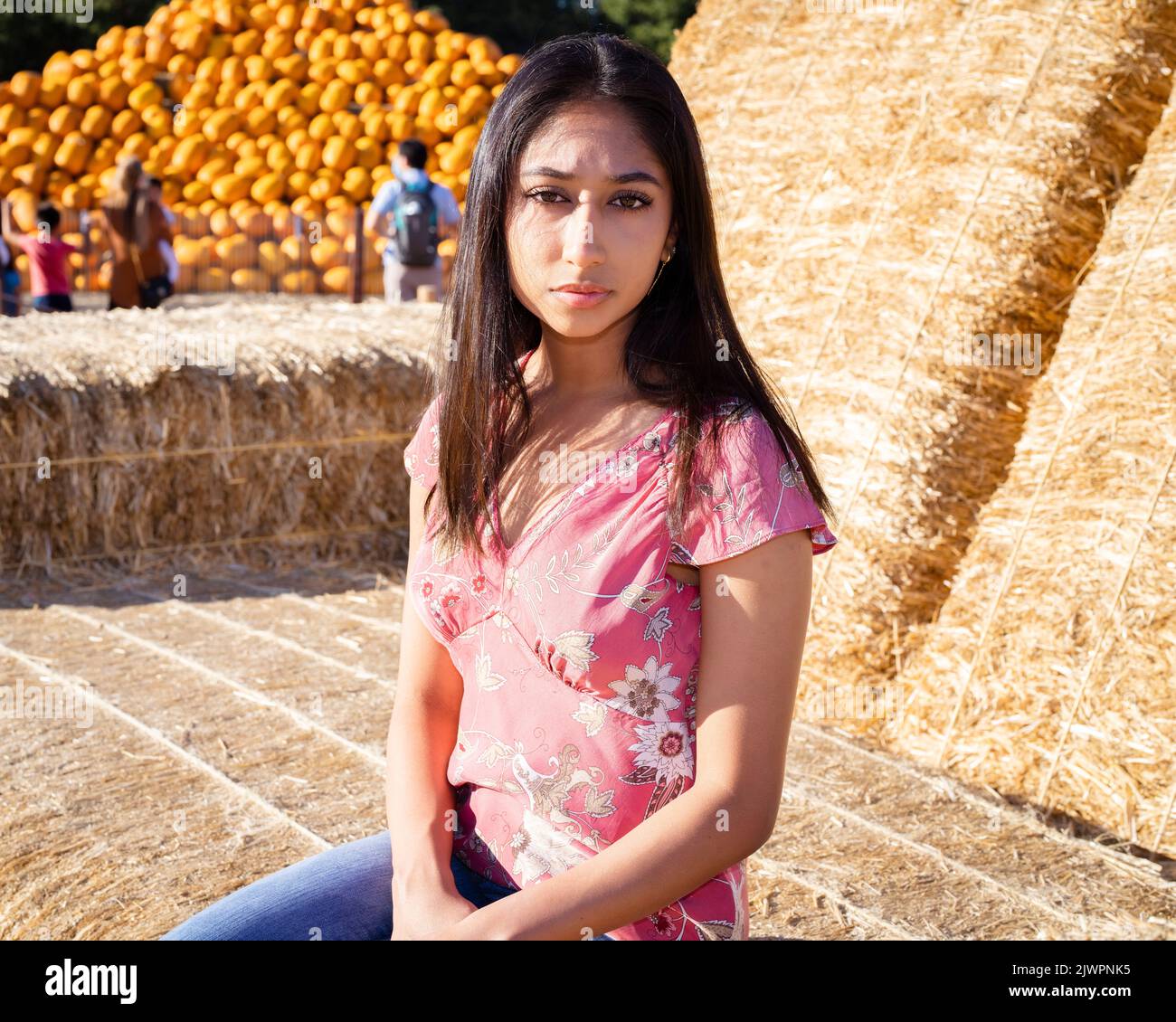 Fall Celebration Portrait of Young Asian Woman Seated on Comically ...