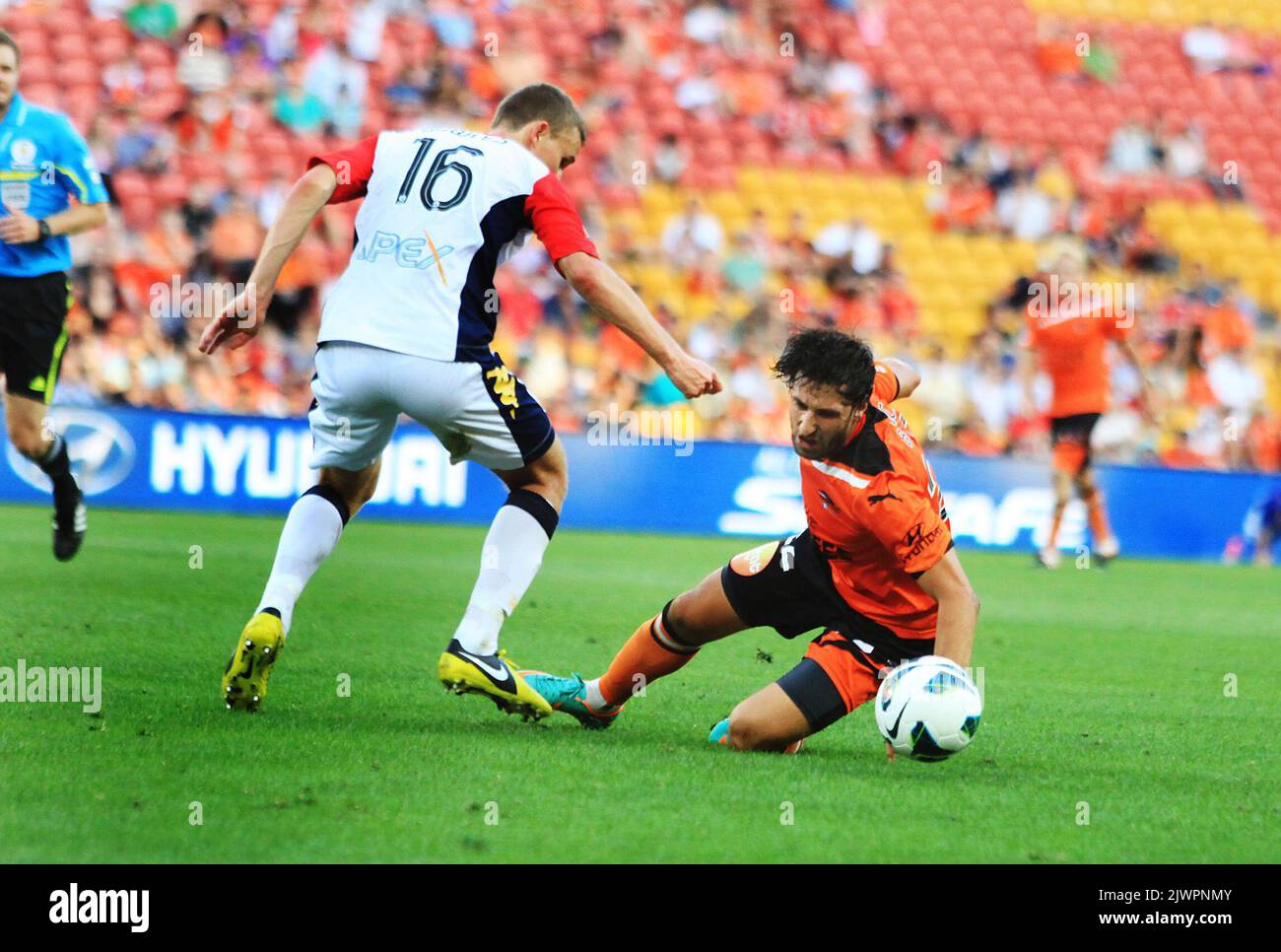 Adelaide player Daniel Bowles gets the better of Brisbane's Thomas ...