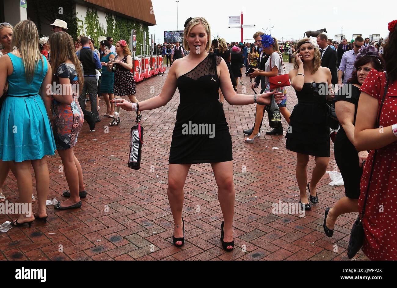 Race goers enjoy the atmosphere late in the day during the Melbourne ...