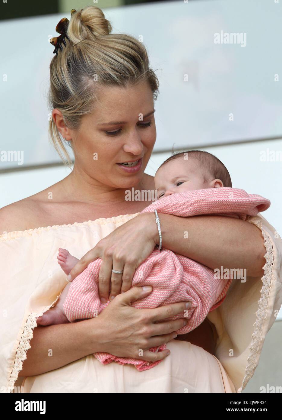 Virginia Cowan and baby Romy are seen after Ed Cowan scored a century ...
