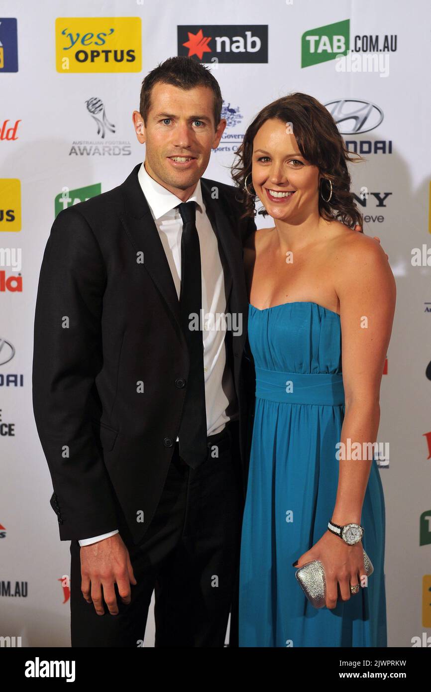 Brett Emerton and his wife Sarah pose for a photograph on their arrival ...