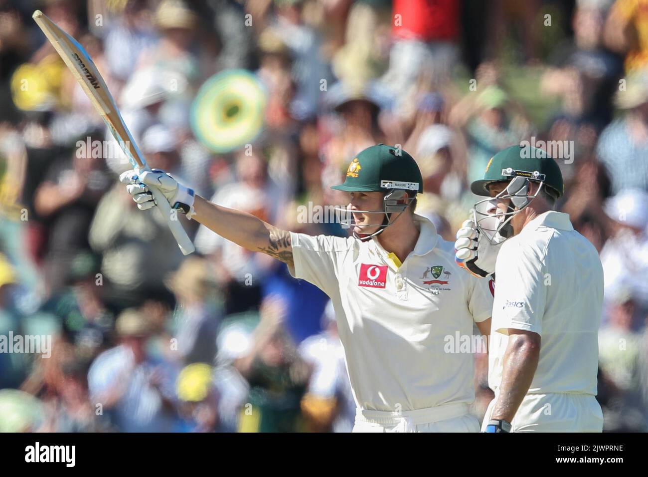 Australia's Michael Clarke (left) celebrates scoring 150 runs with ...