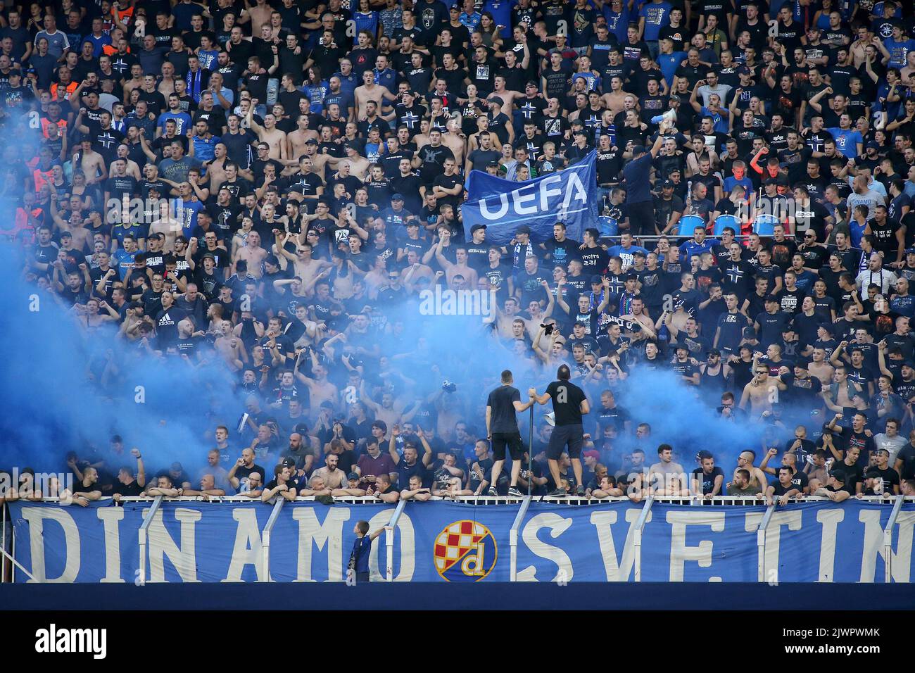 ZAGREB, CROATIA - SEPTEMBER 06: Fans lit flares in the stands during ...