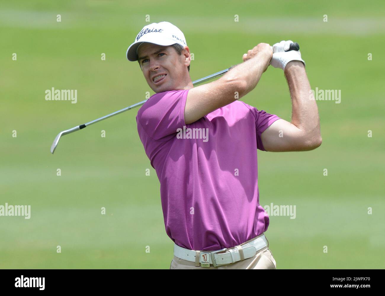 Australian golfer Scott Strange plays an approach shot on the 9th ...