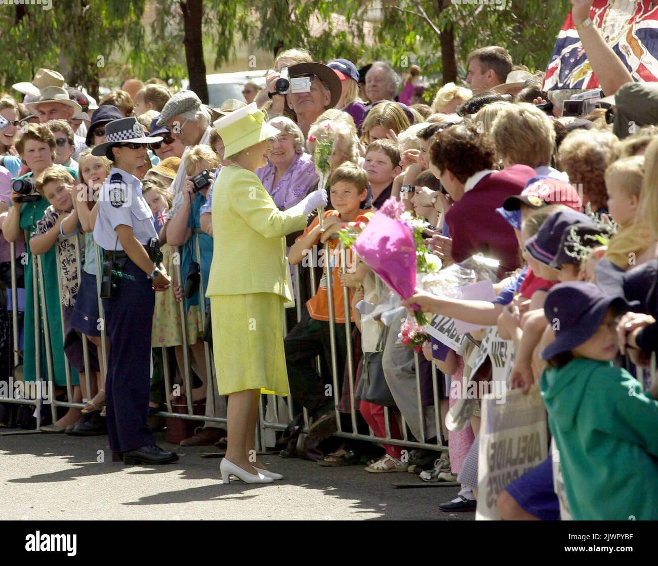 PA PHOTOS/AAP - UK USE ONLY: Queen Elizabeth II receives flowers from ...