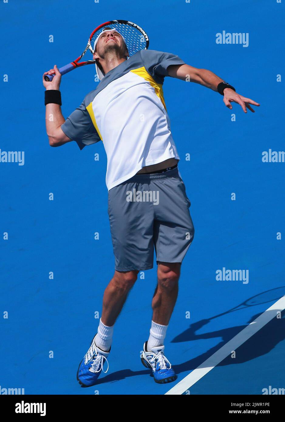 Paul-Henri Mathieu of France hits a serve in the second round match ...