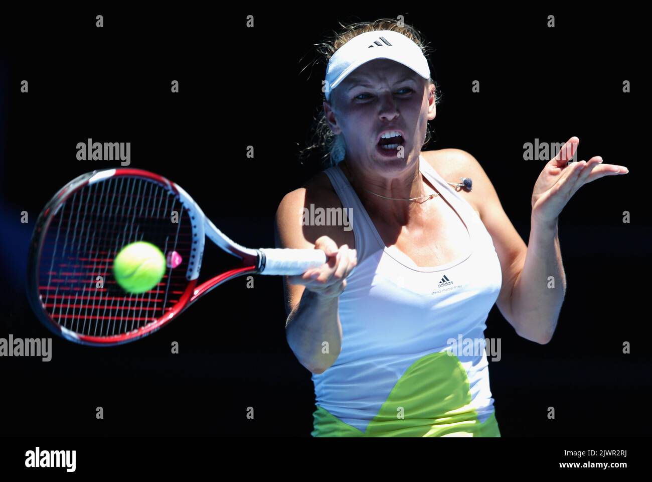 Caroline Wozniacki of Denmark plays a forehand during her match against ...