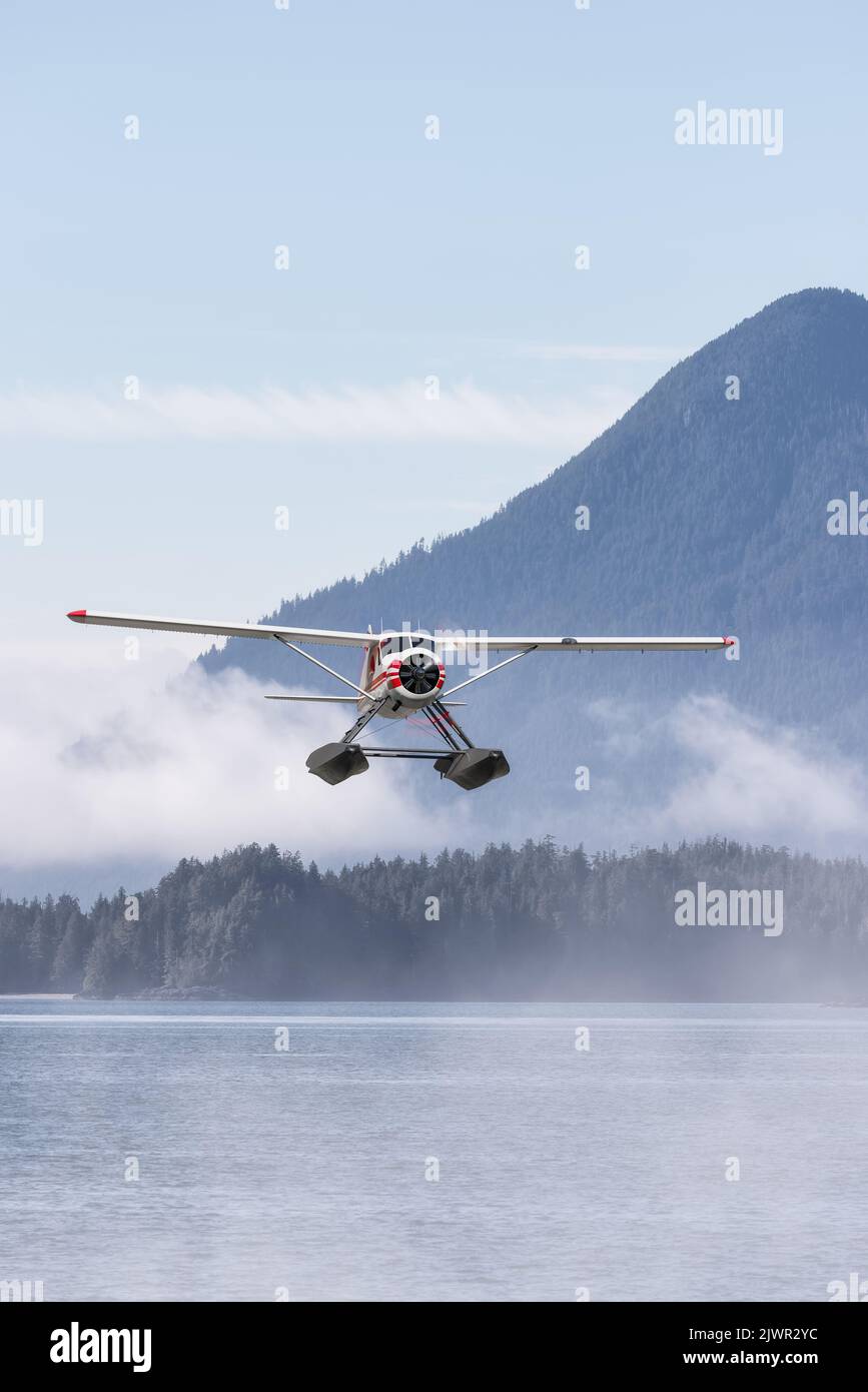 Seaplane Flying over the West Coast Pacific Ocean. Adventure Composite ...
