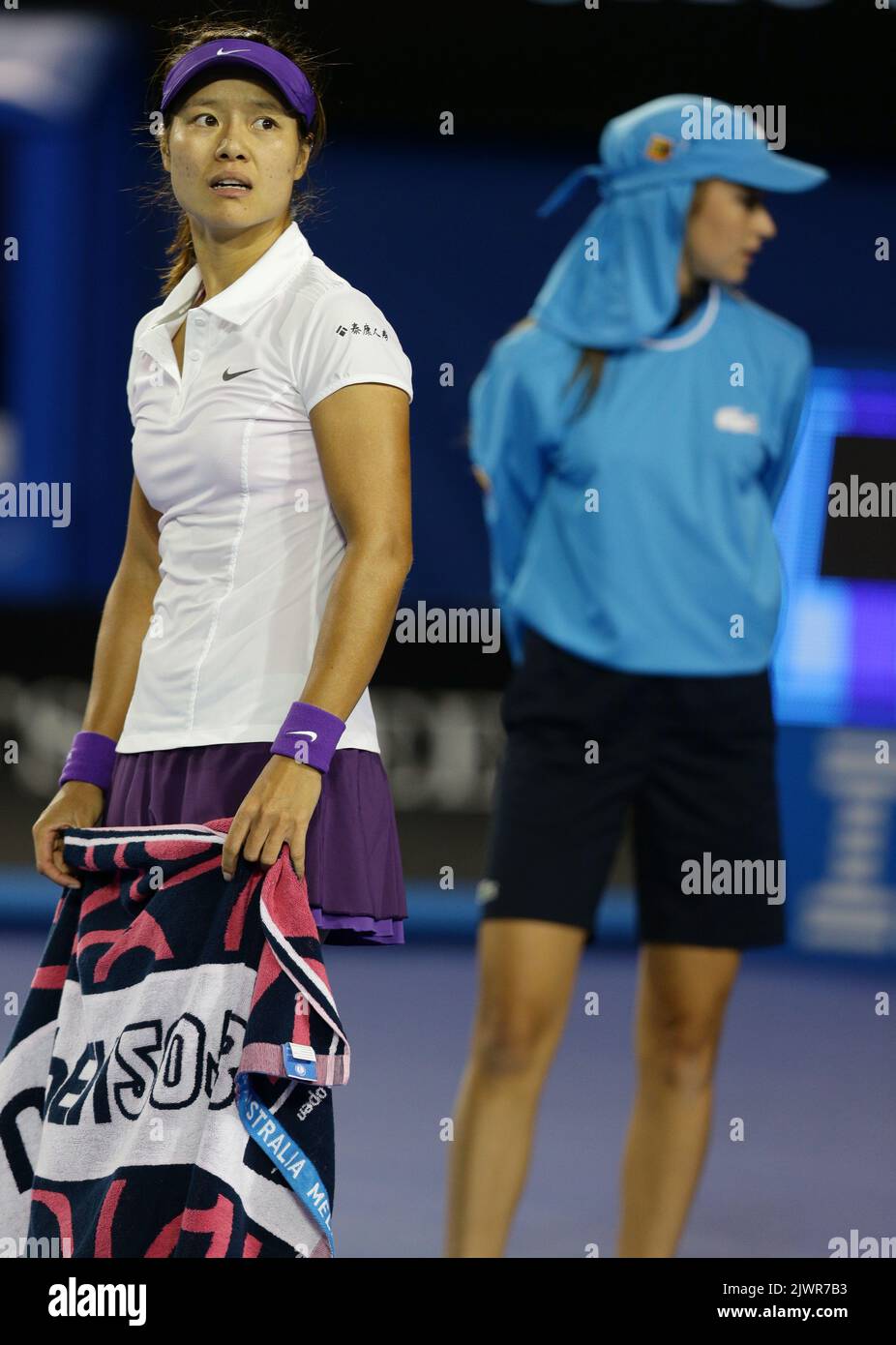 Li Na of China after falling during her match against Victoria Azarenka ...