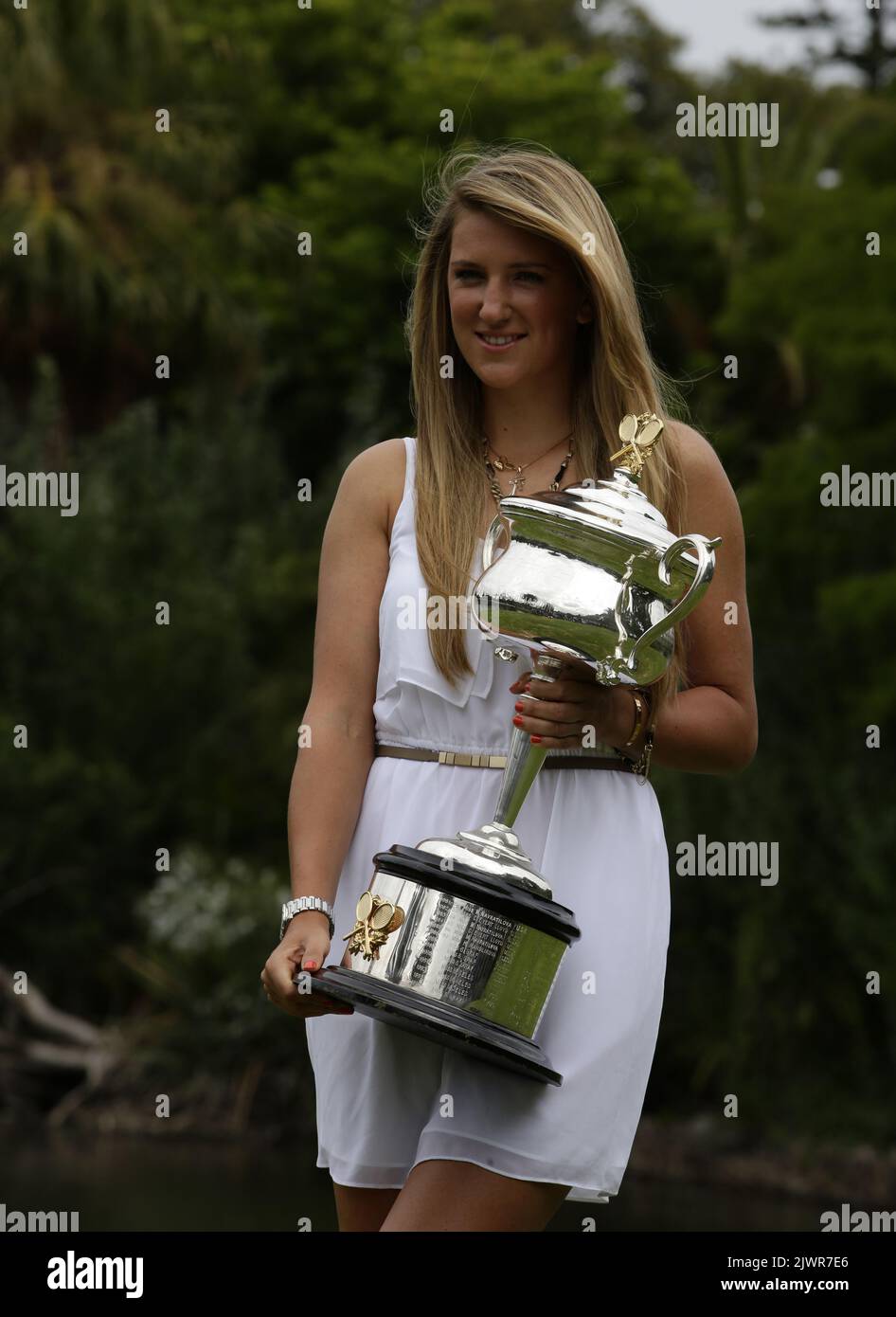 Victoria Azarenka of Belarus poses with trophy to the photographers ...