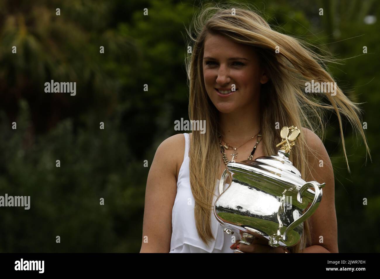 Victoria Azarenka of Belarus poses with trophy to the photographers ...