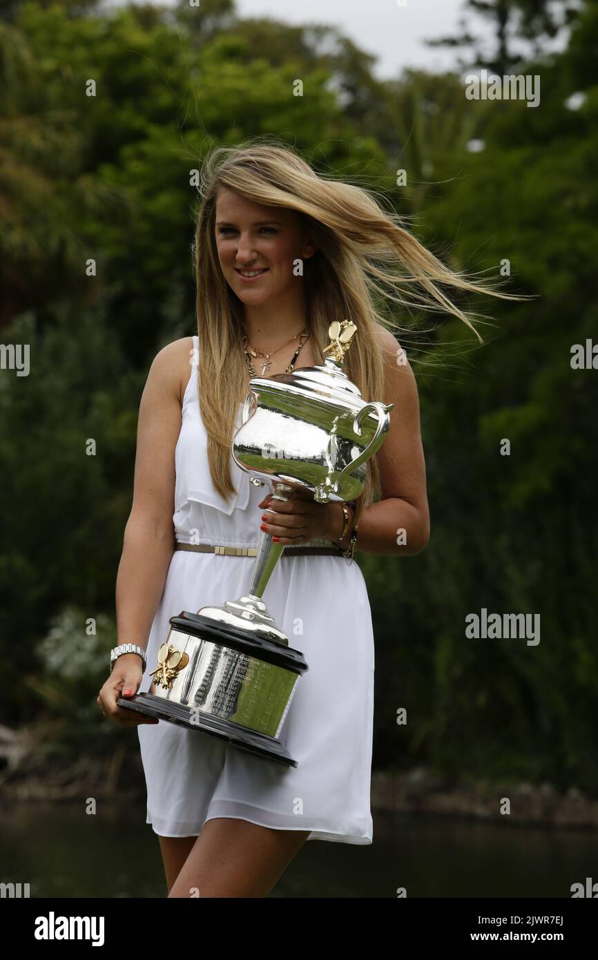 Victoria Azarenka of Belarus poses with trophy to the photographers ...