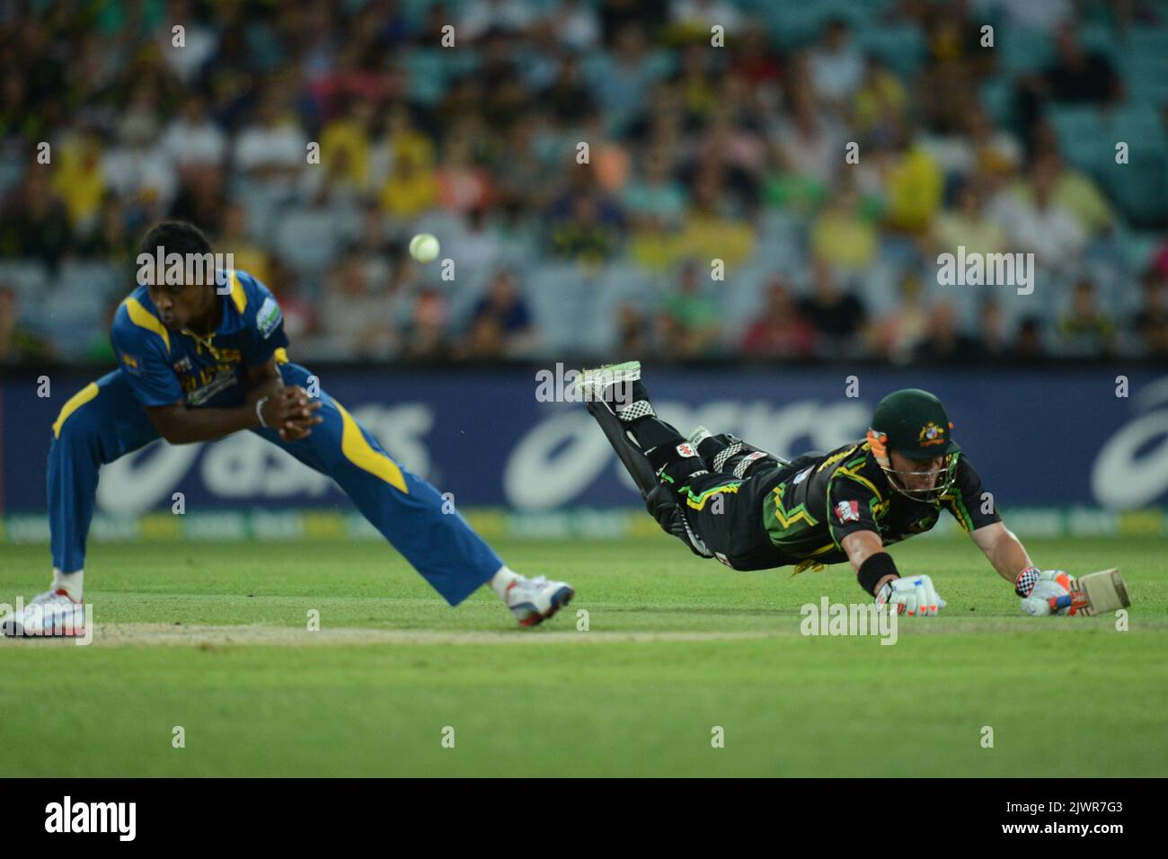 Australia's Dave Warner dives for the crease during their Twenty20 ...