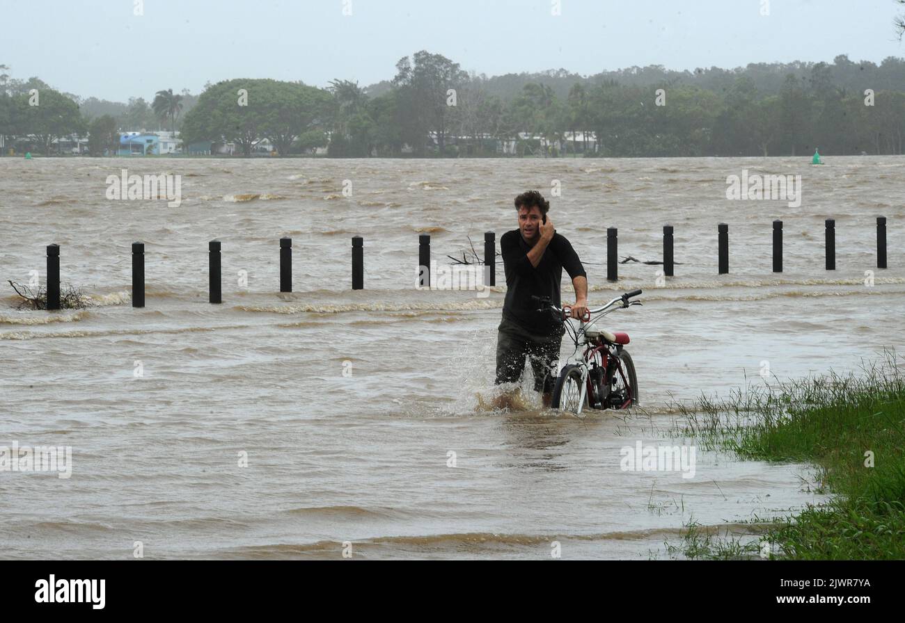 A swollen Tweed River floods over the roads at Chinderah in far north ...