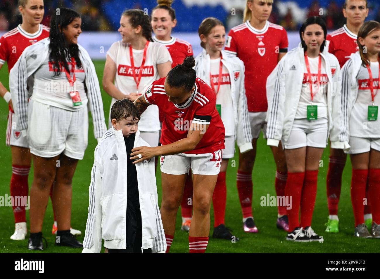 Wales' Natasha Harding gives a coat to a mascot ahead of the 2023 FIFA ...