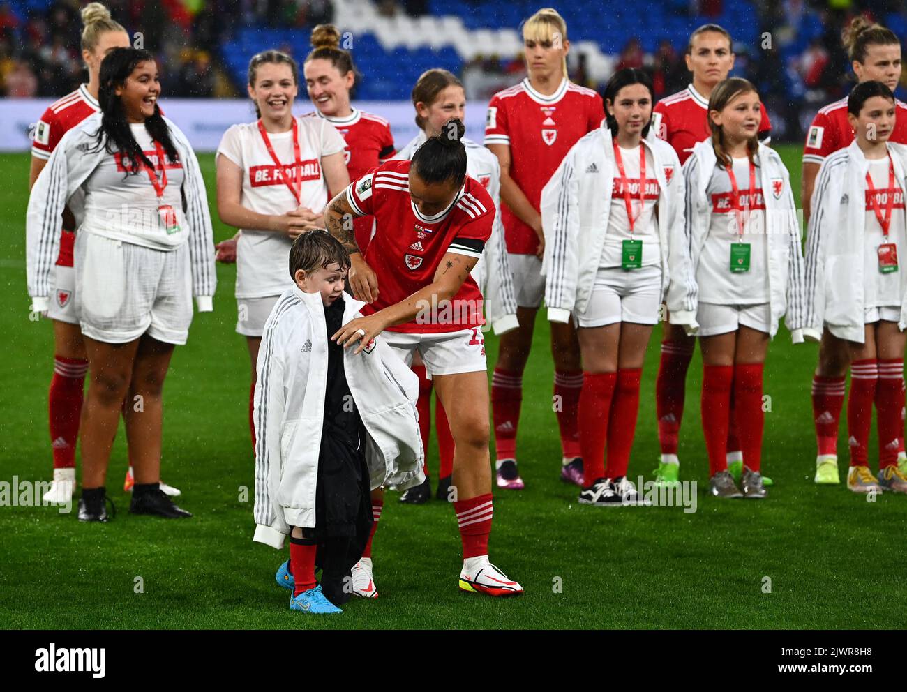 Wales' Natasha Harding gives a coat to a mascot ahead of the 2023 FIFA ...