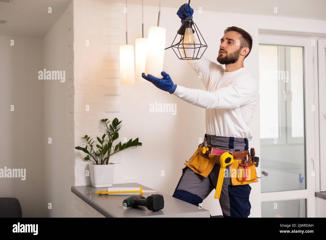 Electrician installs switch socket hi-res stock photography and images ...
