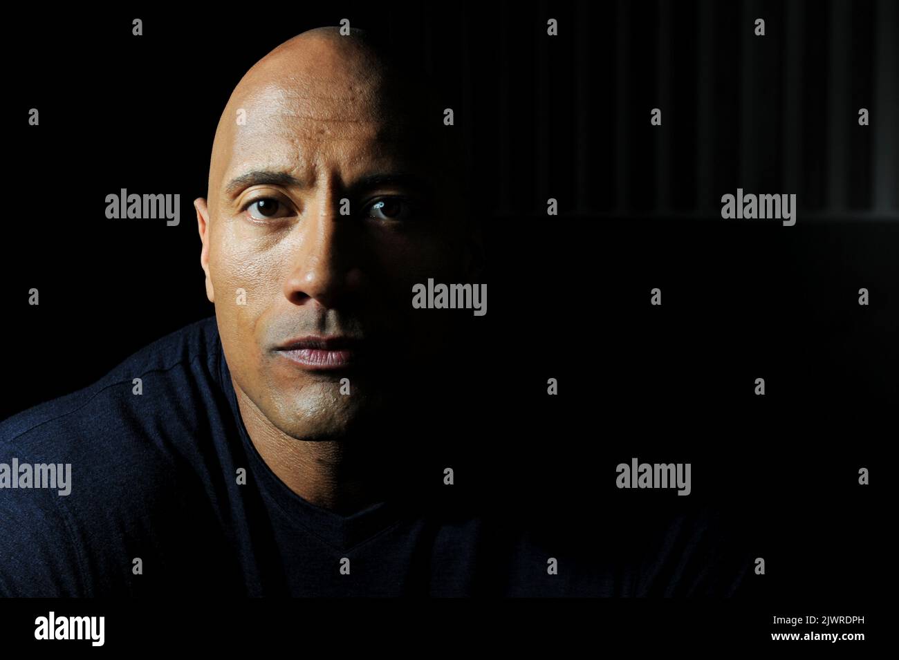 American actor Dwayne Johnson poses for photographs in Sydney, Thursday ...