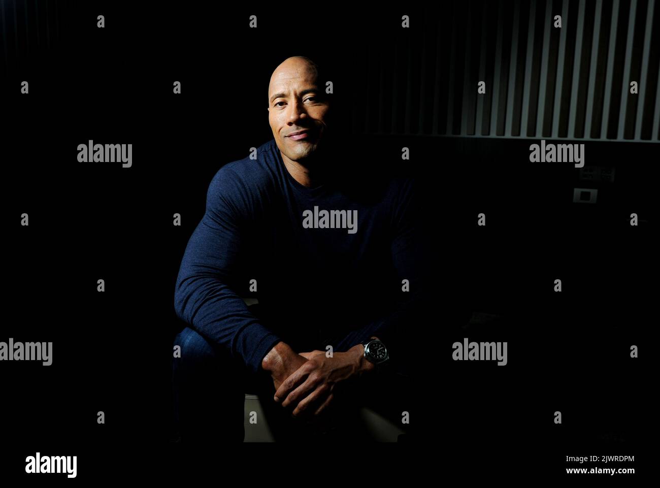 American actor Dwayne Johnson poses for photographs in Sydney, Thursday ...