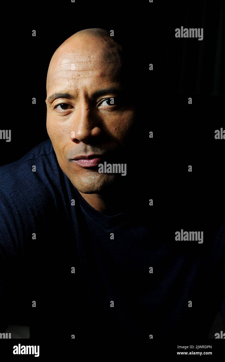 American actor Dwayne Johnson poses for photographs in Sydney, Thursday ...