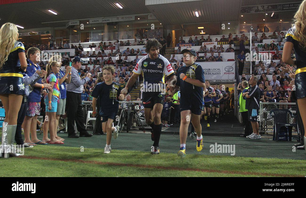 Johnathan Thurston leads the team out during the NRL Round 2 match ...