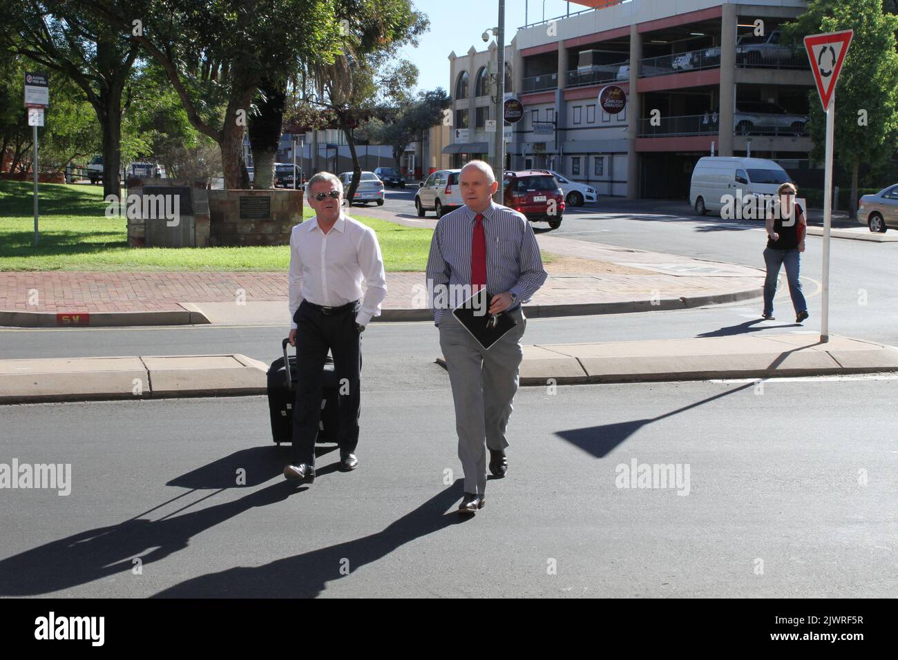 Defence lawyer Jon Tippett, QC (left), and John McBride (red tie) head ...