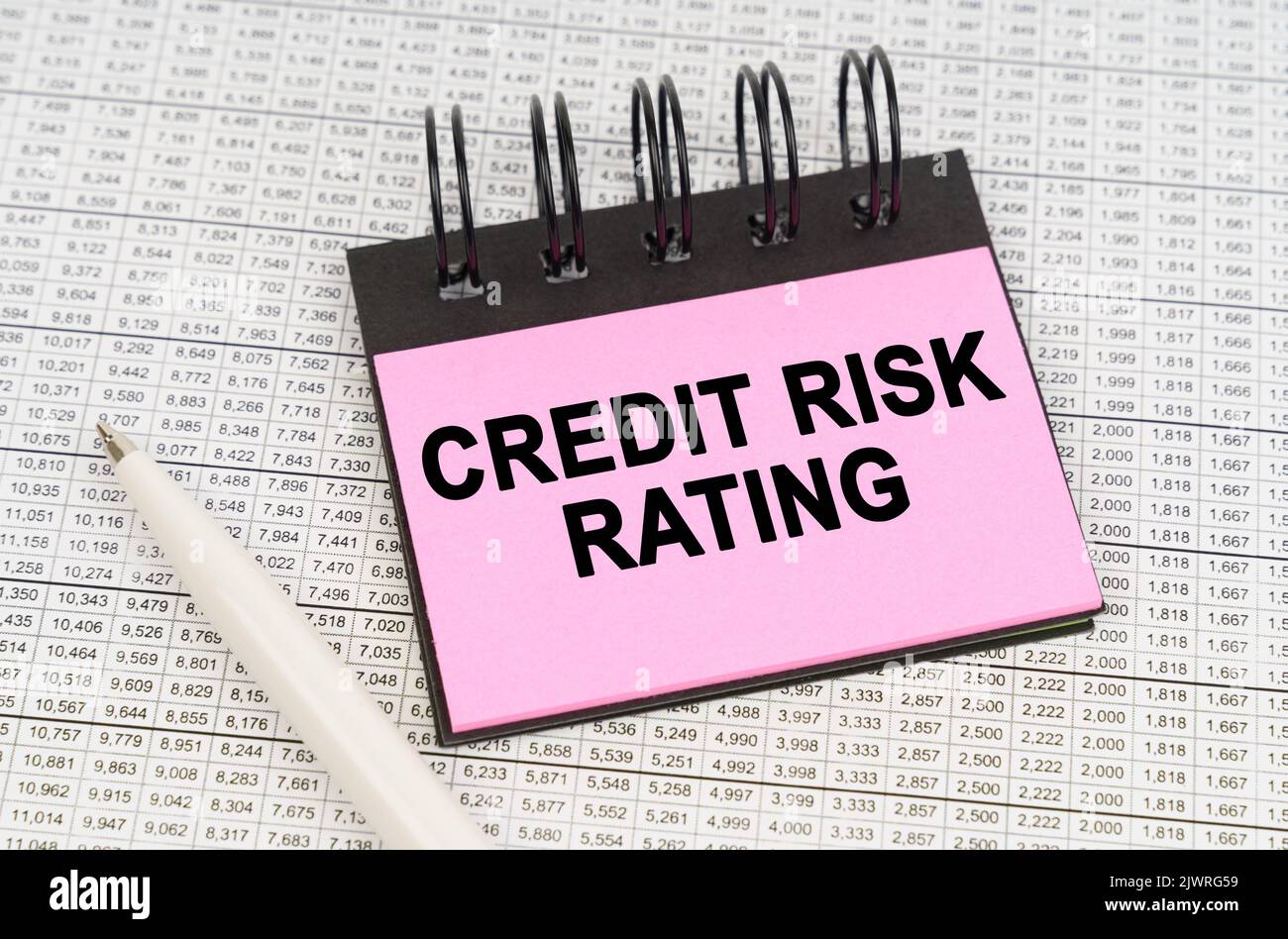 Business concept. On reporting documents and charts there is a pen and a notepad with the ...