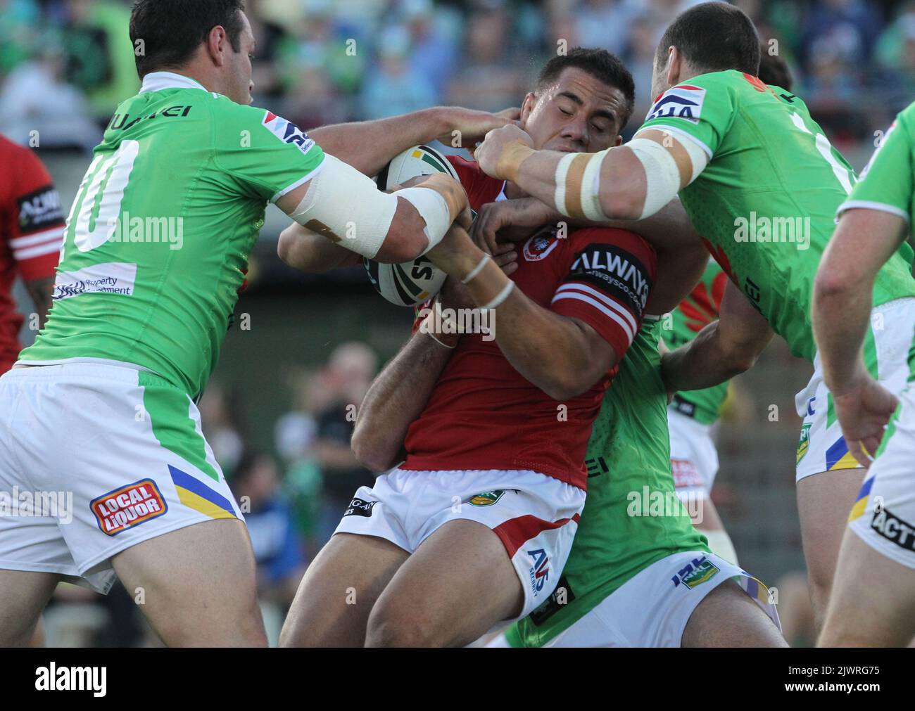 Bronson Harrison swamped during the NRL Round 3, match between Canberra ...