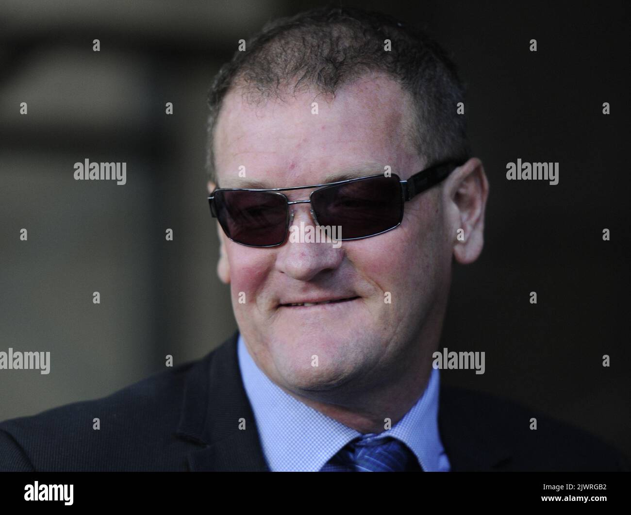 Former AFL player agent Ricky Nixon waits in line at the Melbourne ...