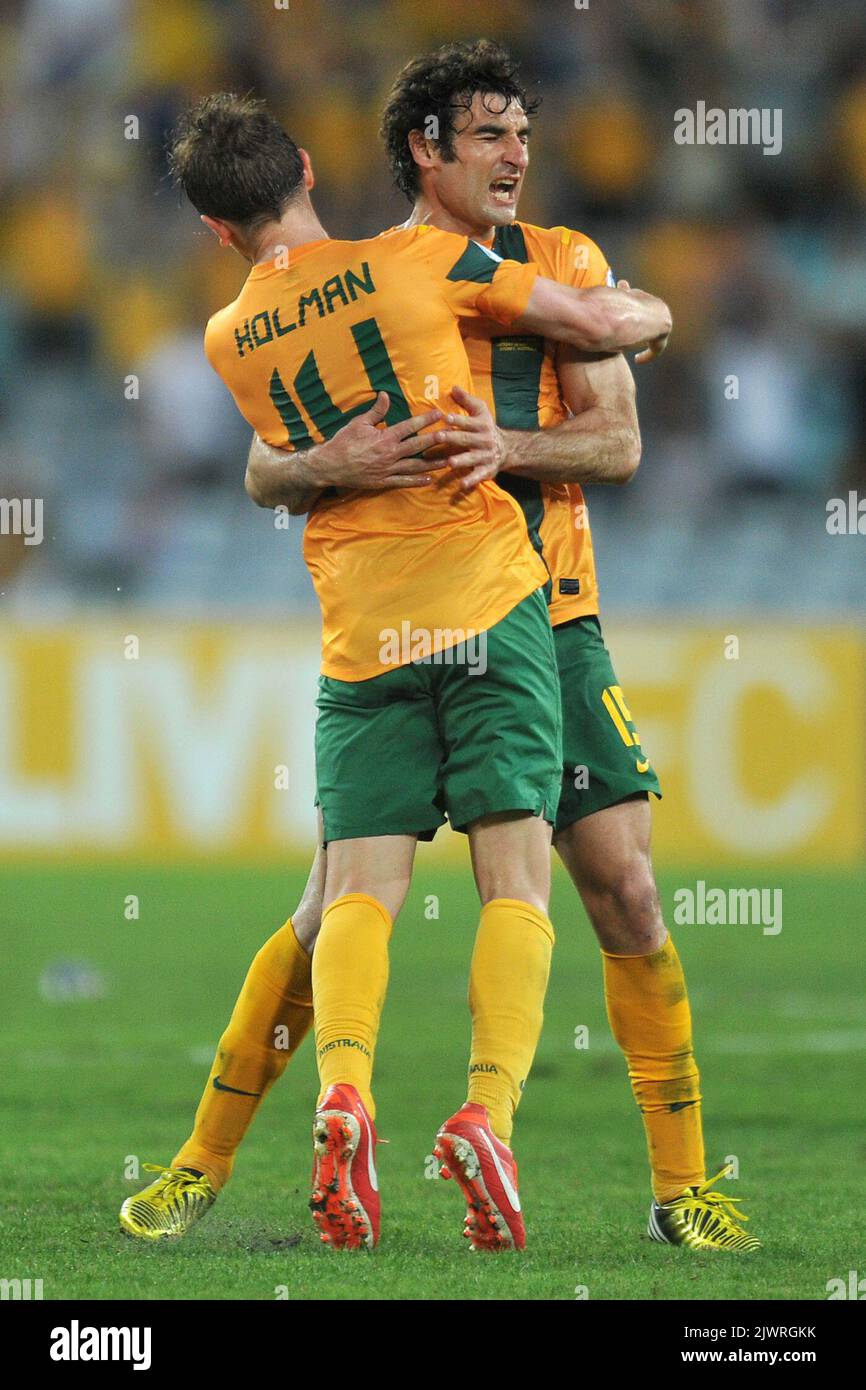 Australia's Mile Jedinak (right) congratulates Brett Holman on his goal ...