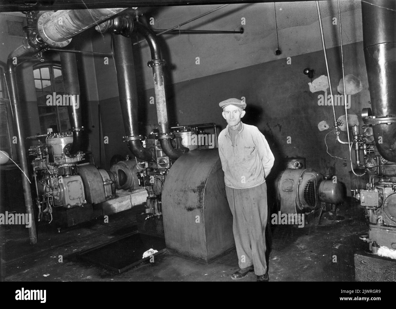 Mechanist and steam panman John Kurberg. The machine hall in the steam ...