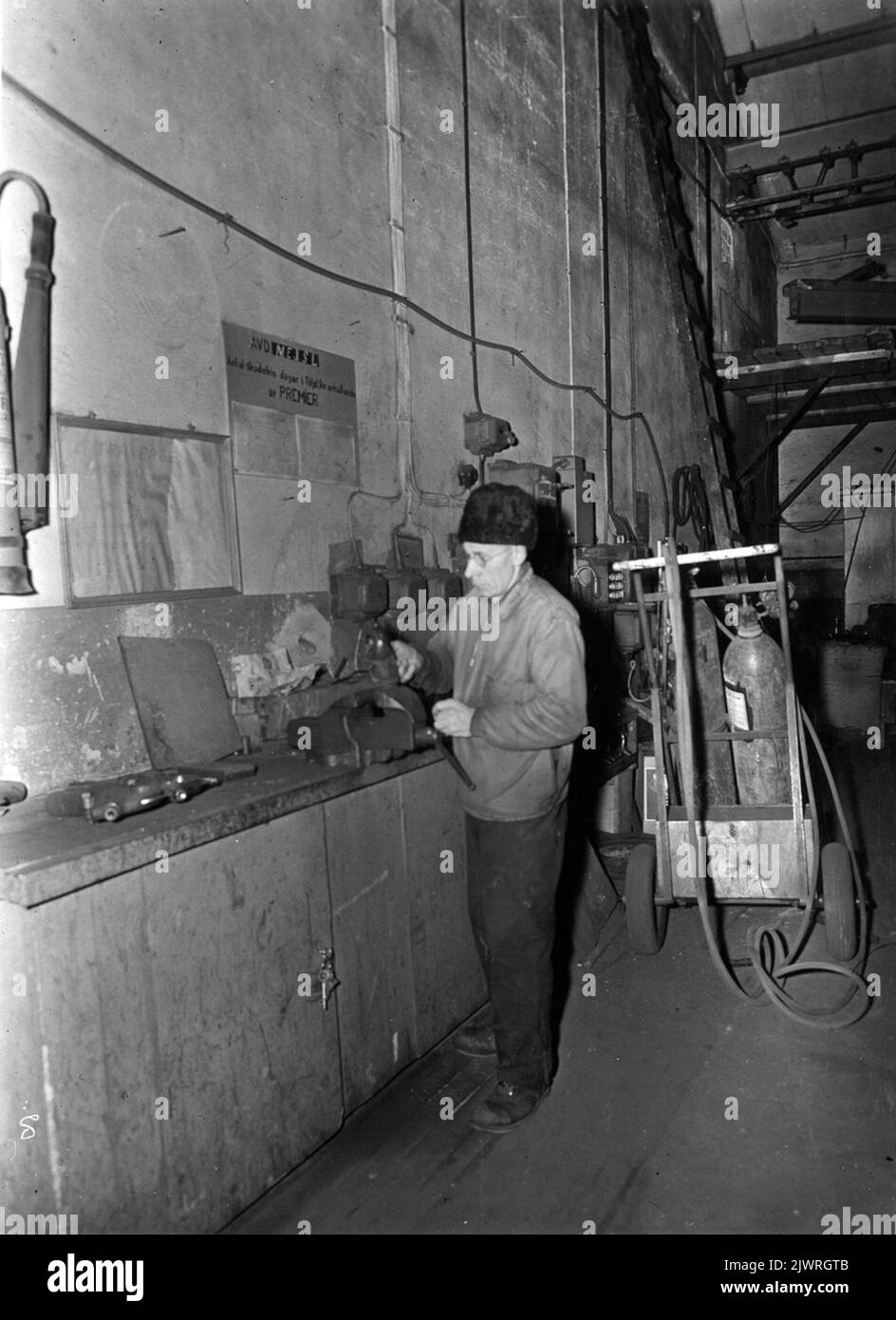 Karl August Holmberg at a workbench in the chisel hall, December 4 ...