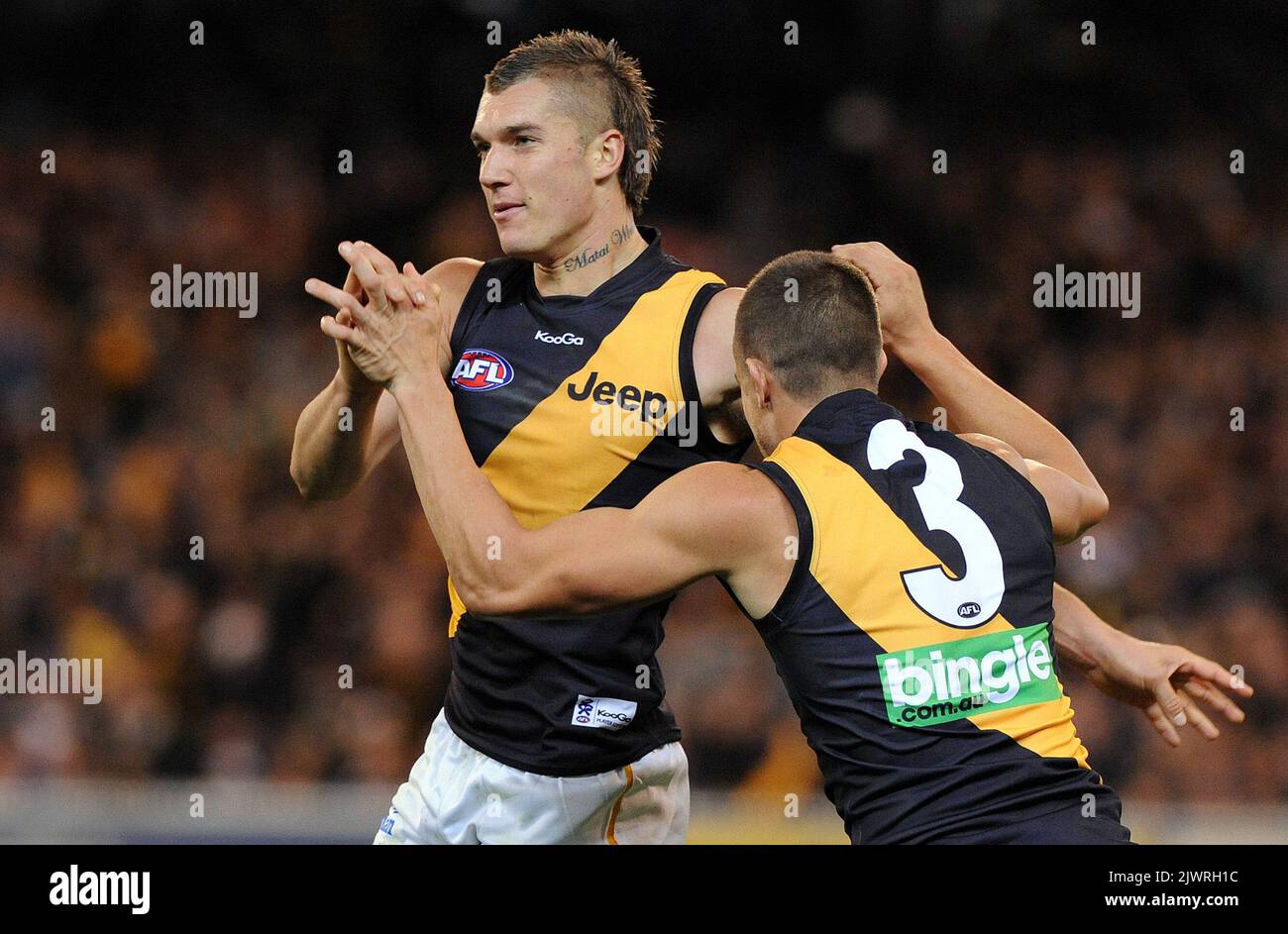 Dustin Martin of Richmond is congratulated by team-mate Brett Deledio ...