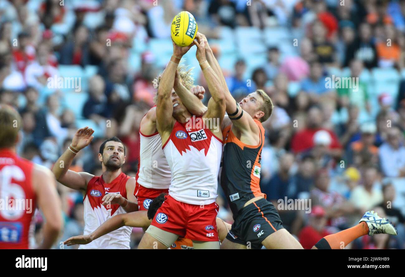 Sydney Swans' Ted Richards takes a mark despite pressure from Greater ...