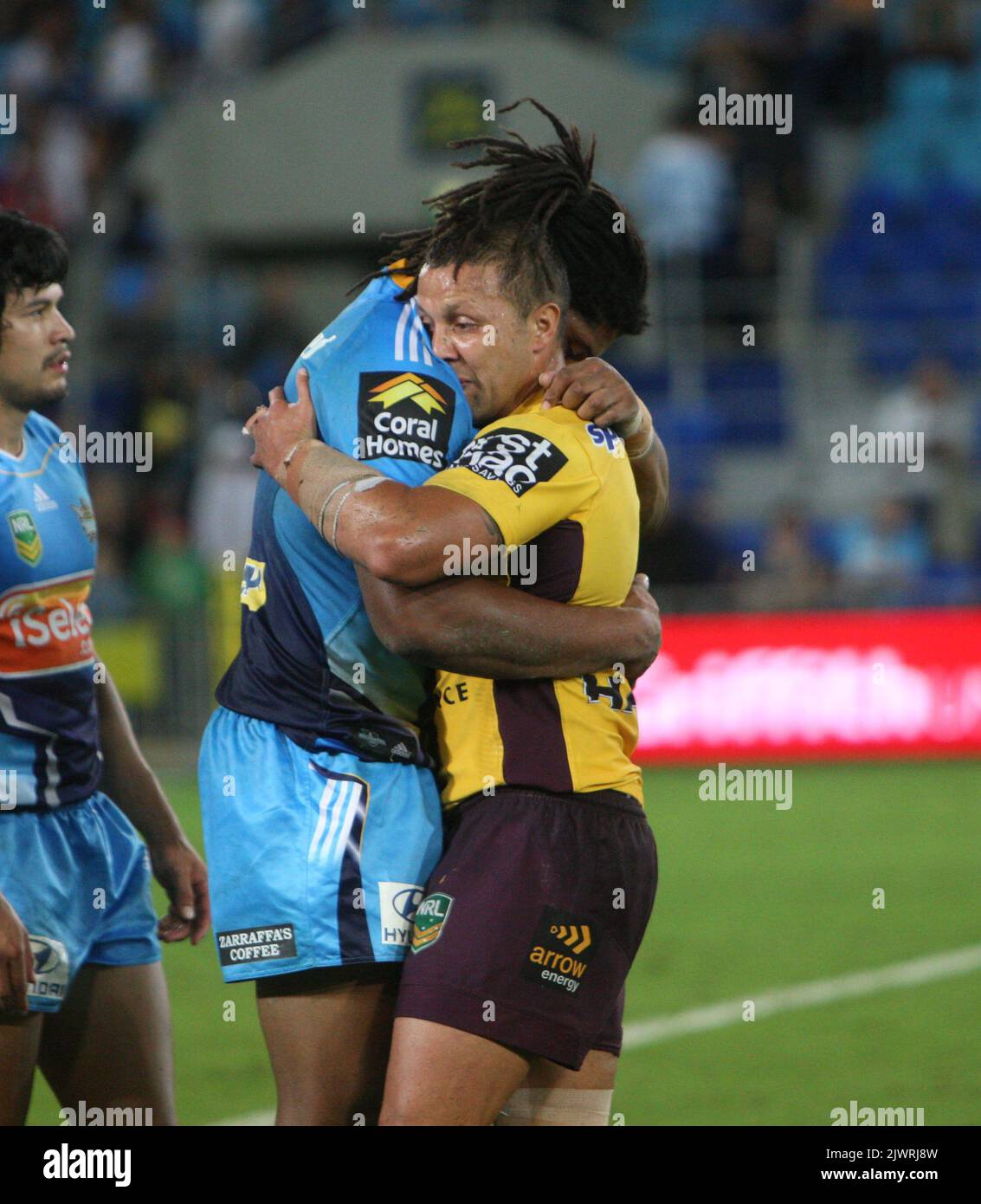 Ex Gold Coast Captain Scott Prince hugs Jamal Idris after the match ...