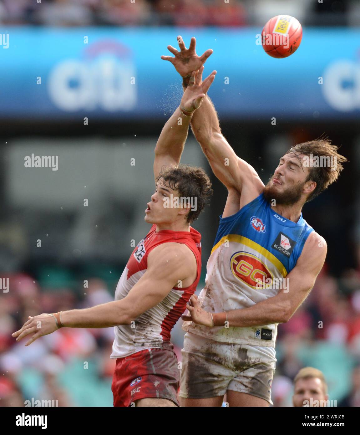 Sydney Swans' Mike Pyke and the Gold Coast Suns' Charlie Dixon go for a ...