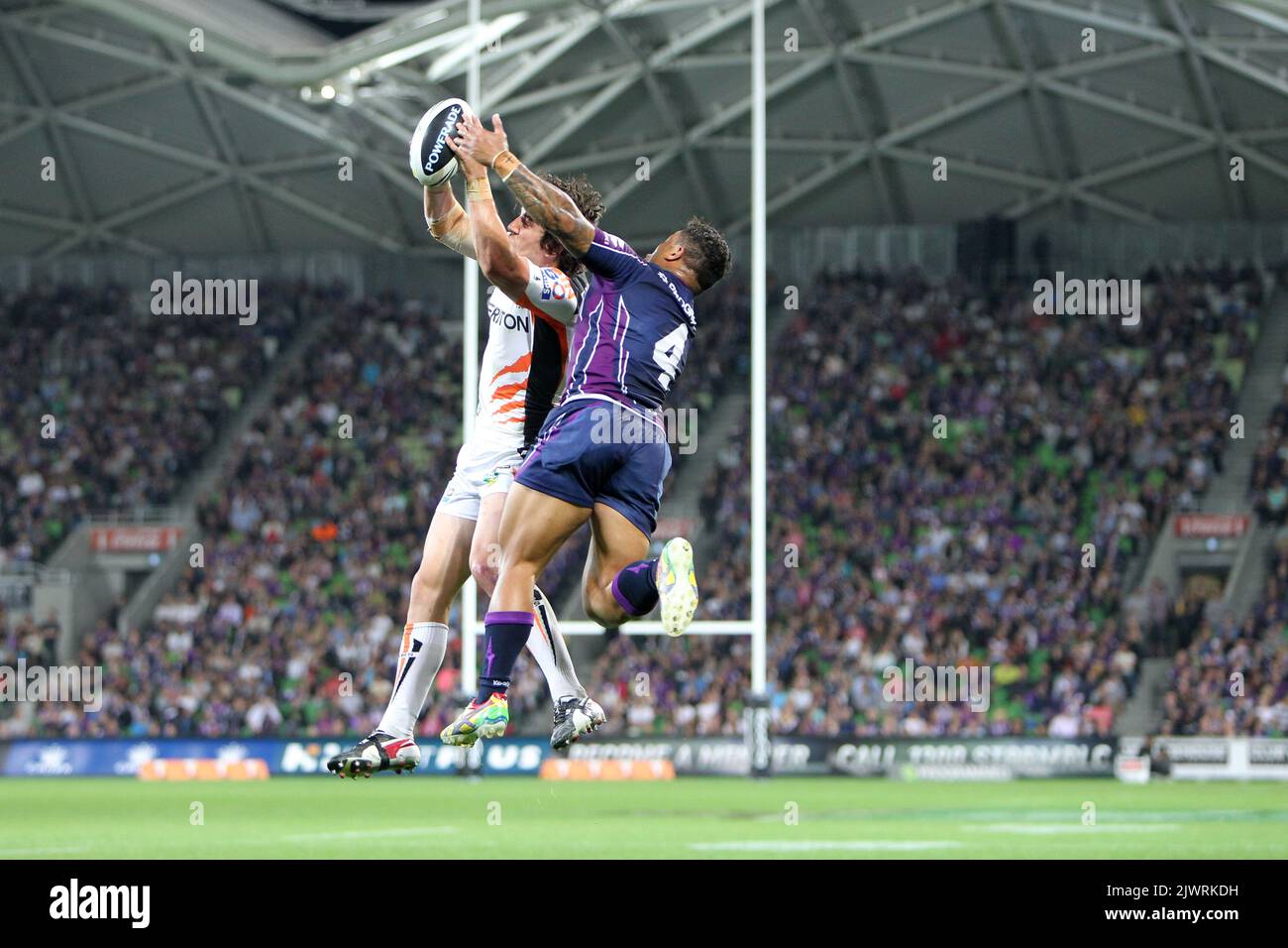 Tafeaga Junior Sa'u and Chris Lawrence contest a kick during the NRL ...