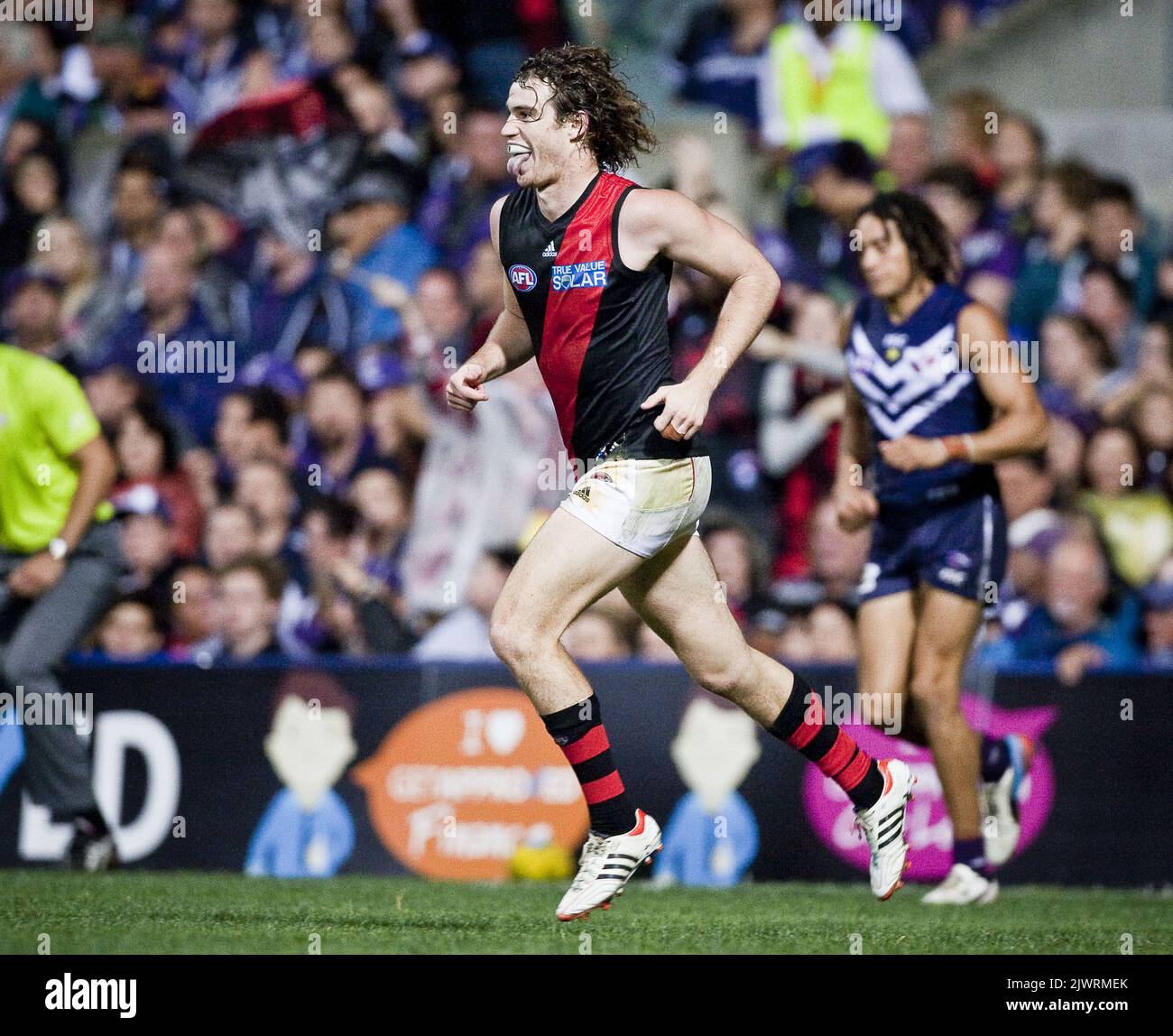 Nicholas Kommer of Essendon (right) celebrates during the round three ...