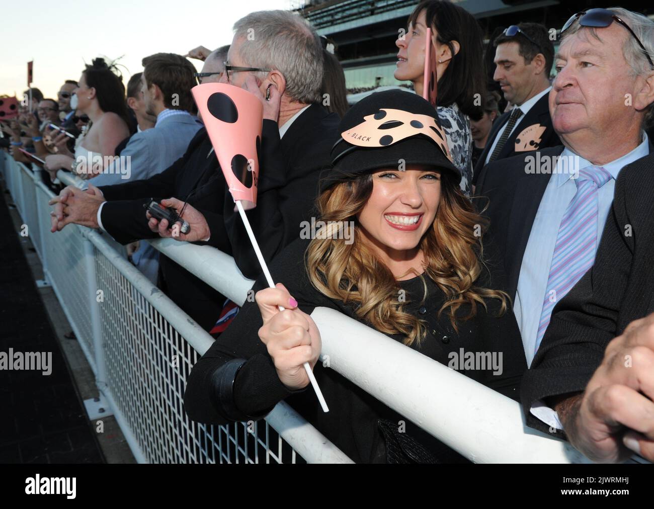Racegoers cheers for Black Caviar ahead of the running of race 9 ...