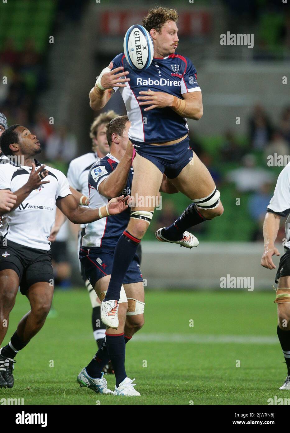Scott Higginbotham of the Rebels gathers the ball during the round 9 ...