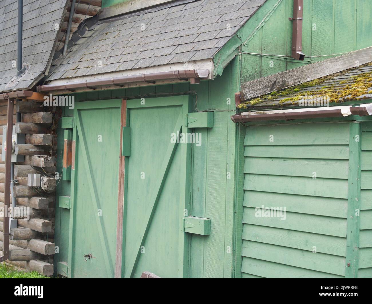 Rustic rural building with mixed cladding and finishes and slate tile ...