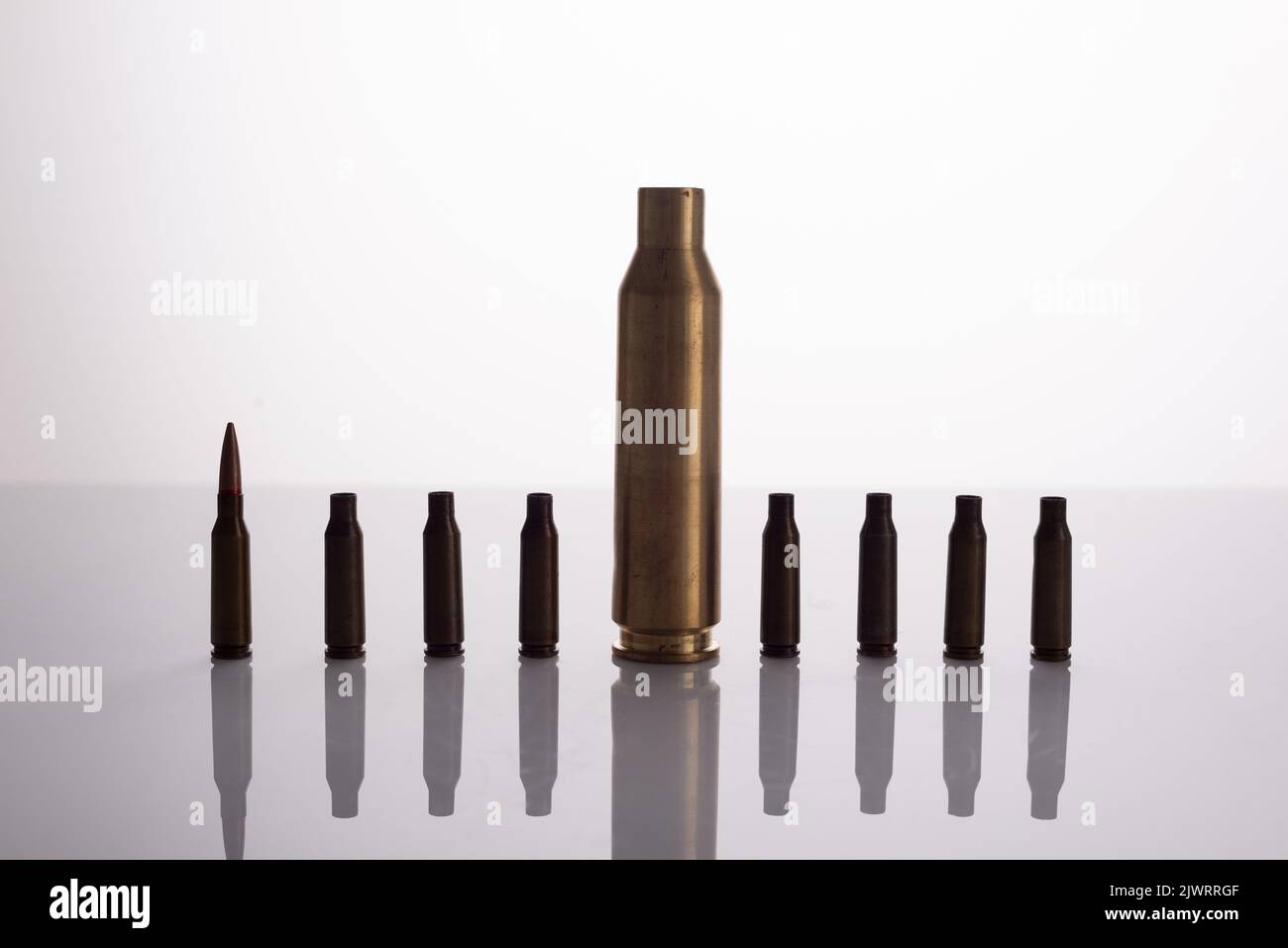 used spent shells of cartridges from a machine gun and a machine gun on ...