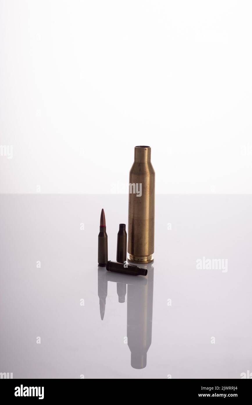 used spent shells of cartridges from a machine gun and a machine gun on ...