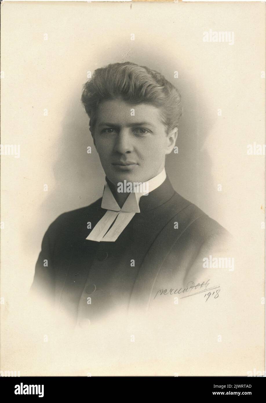 Unknown young priest. Okänd ung präst Stock Photo - Alamy