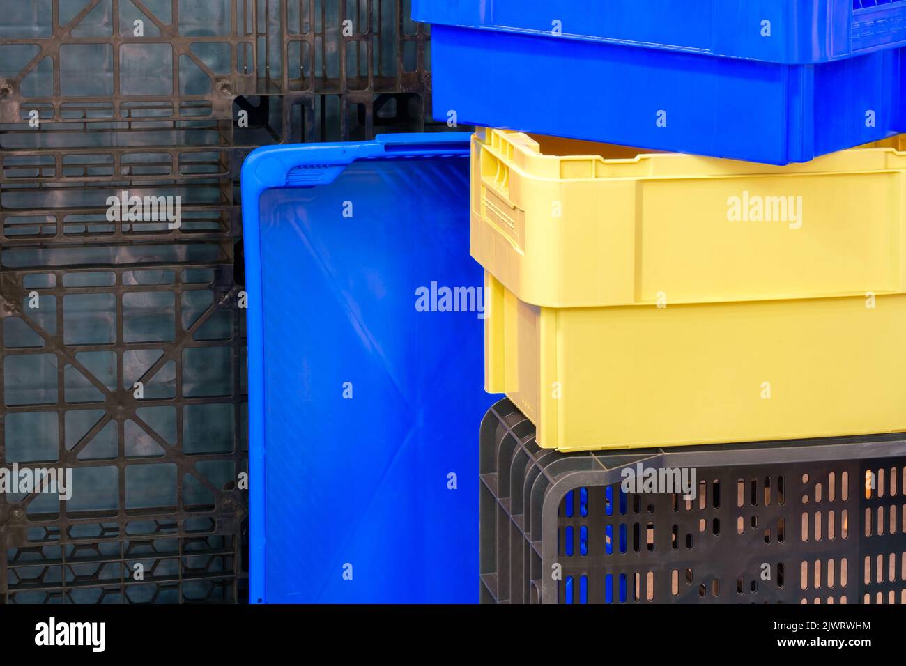 Colorful plastic boxes, logistic concept Stock Photo - Alamy
