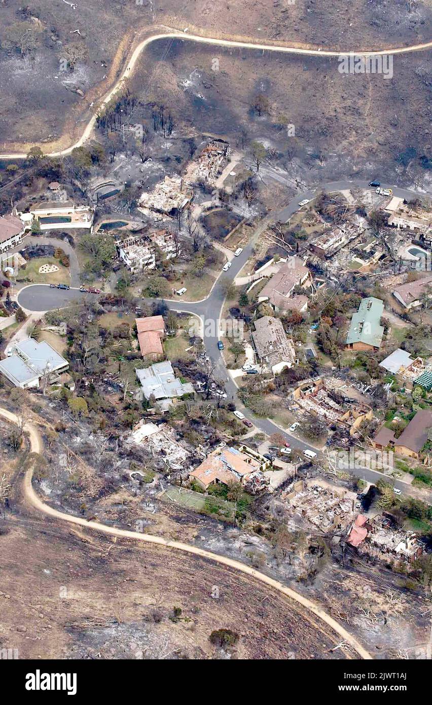 PA PHOTOS/AAP - UK USE ONLY: Destroyed houses in the Canberra suburbs ...