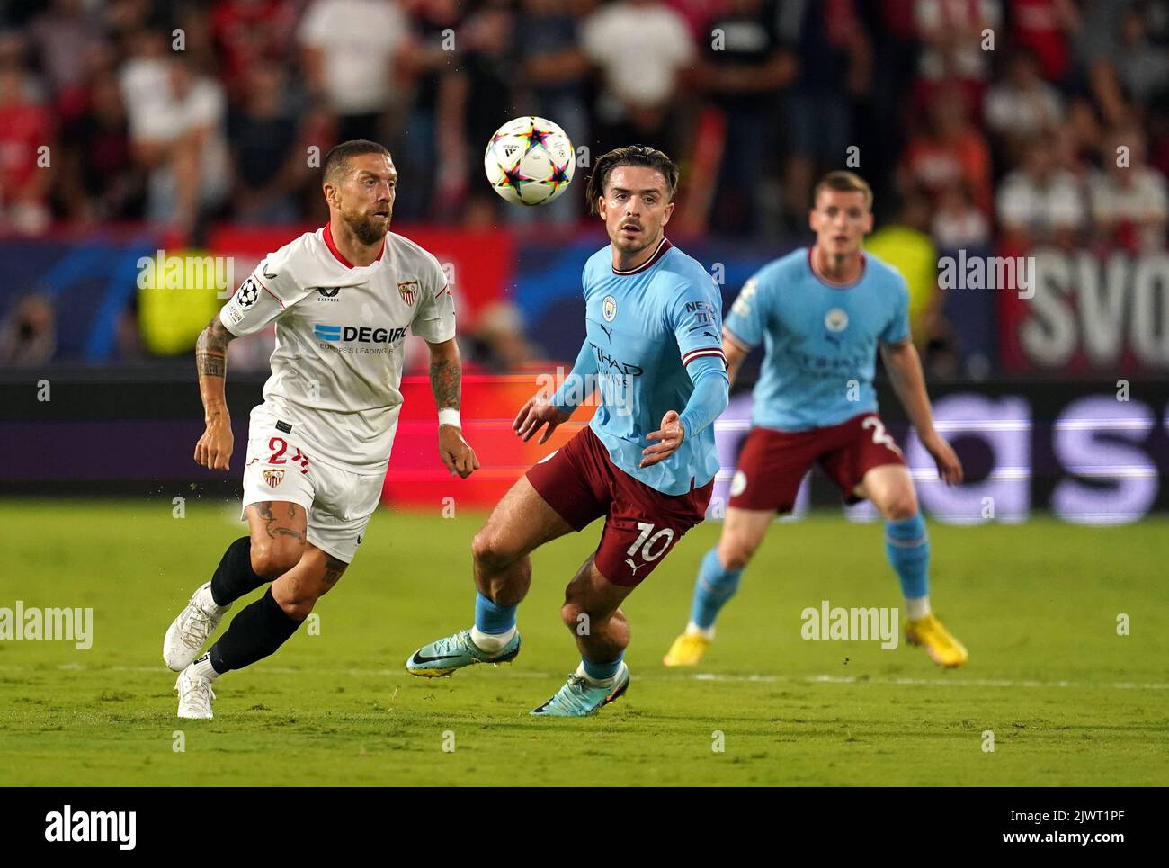 Sevilla's Alejandro Gomez (left) and Manchester City's Jack Grealish ...