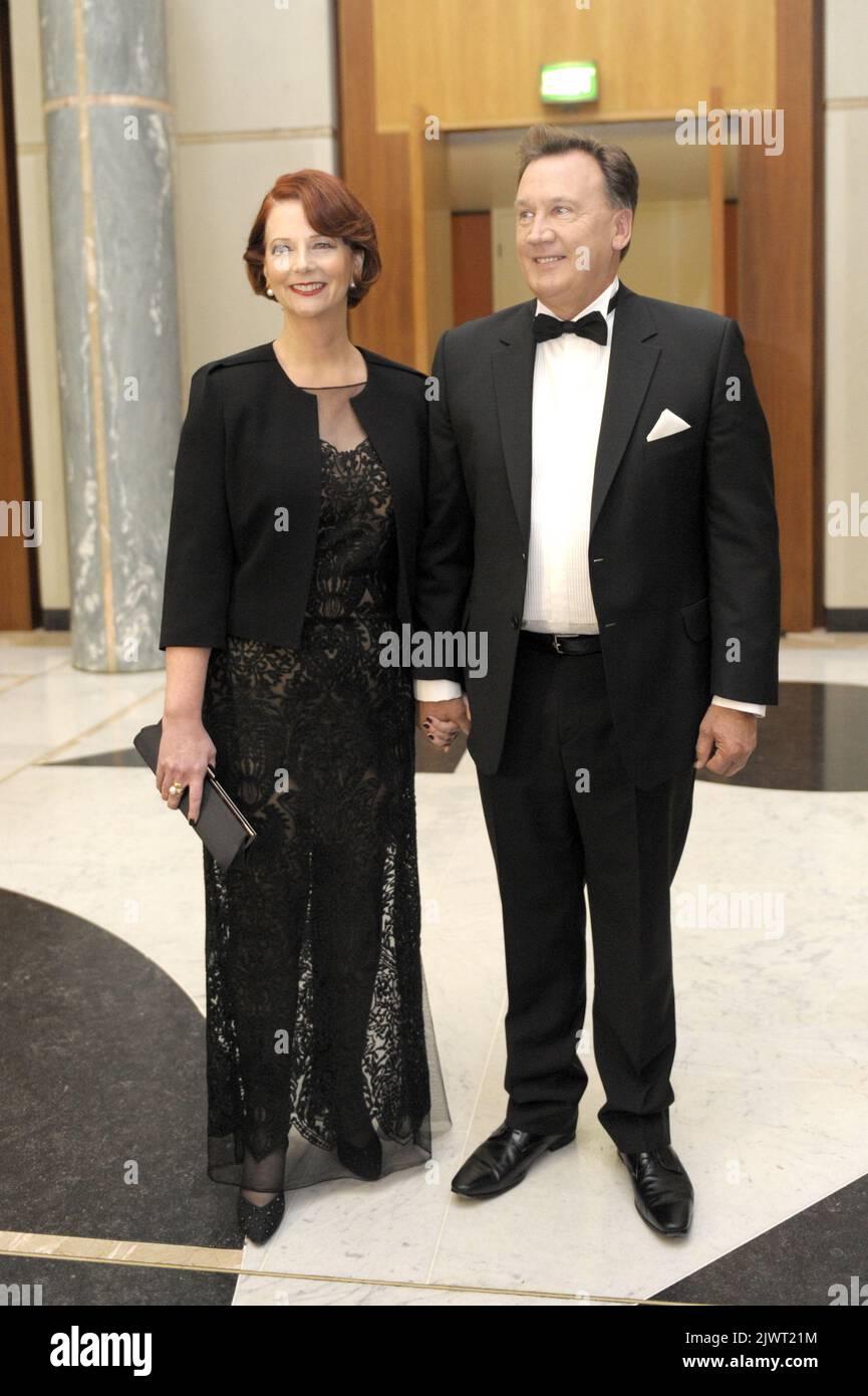 Prime Minister Julia Gillard and Tim Mathieson arrive for the Midwinter ...