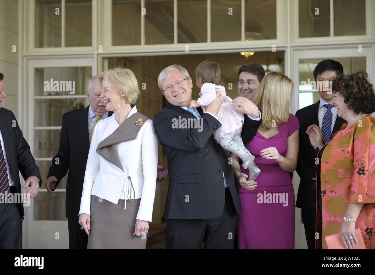 Kevin Rudd holds his granddaughter Josephine after the swearing-in at ...