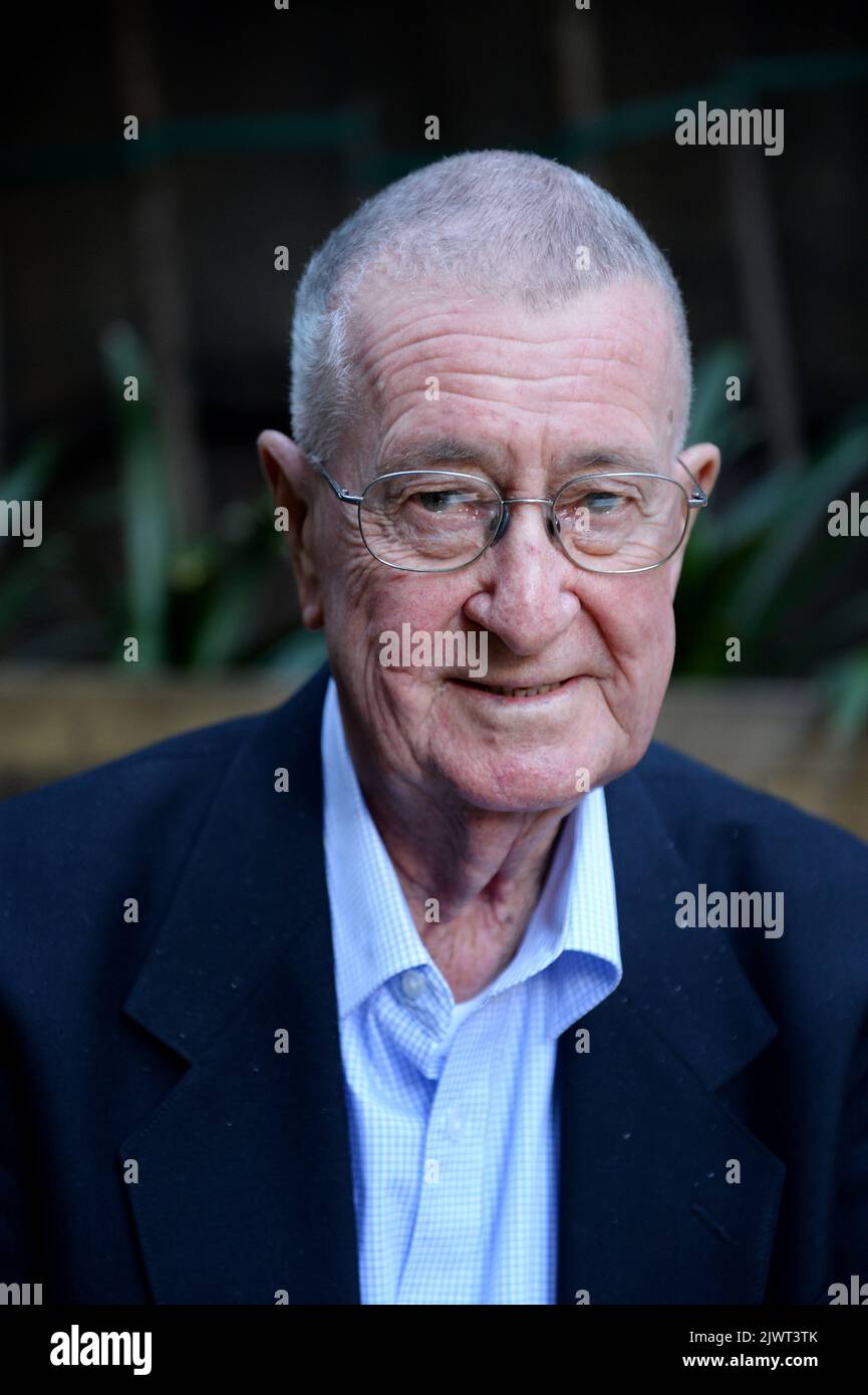 Australian author Denis Ryan poses for photographs in Sydney, Wednesday ...